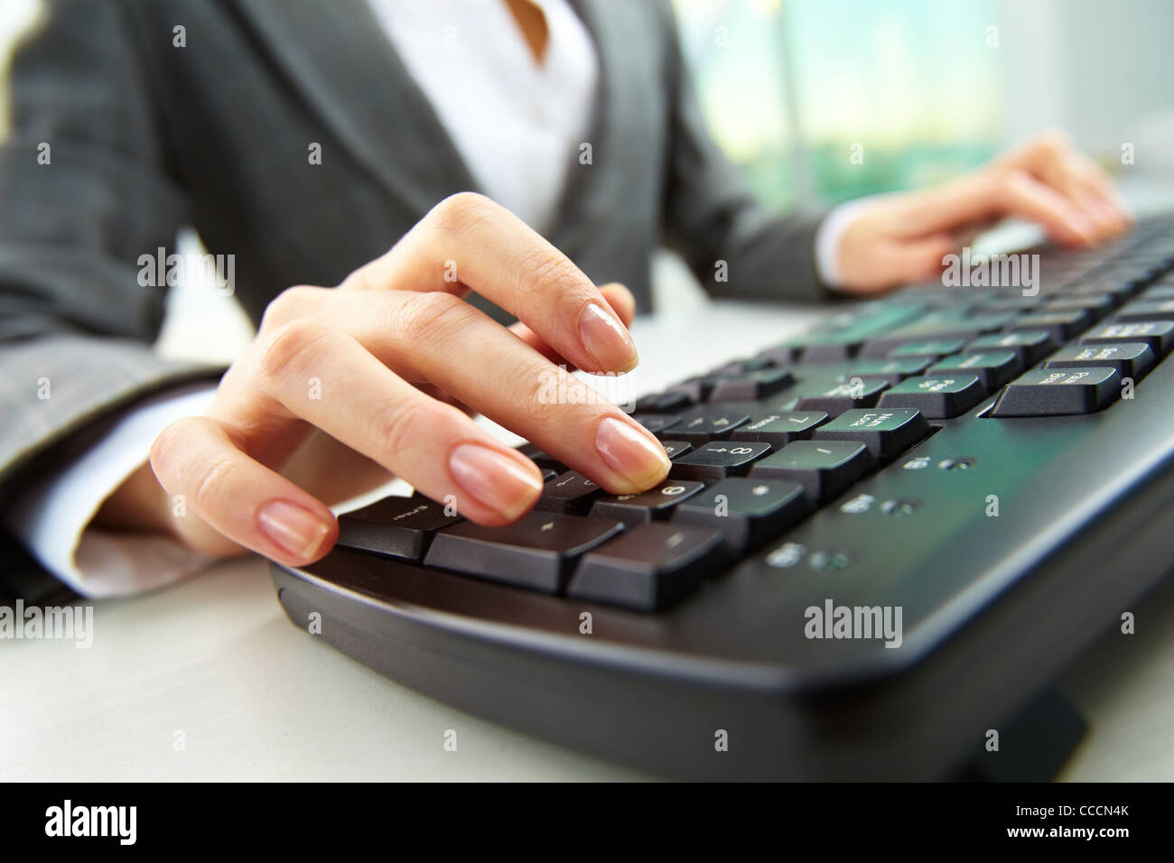 Macro image of human hand with forefinger going to press key on ...
