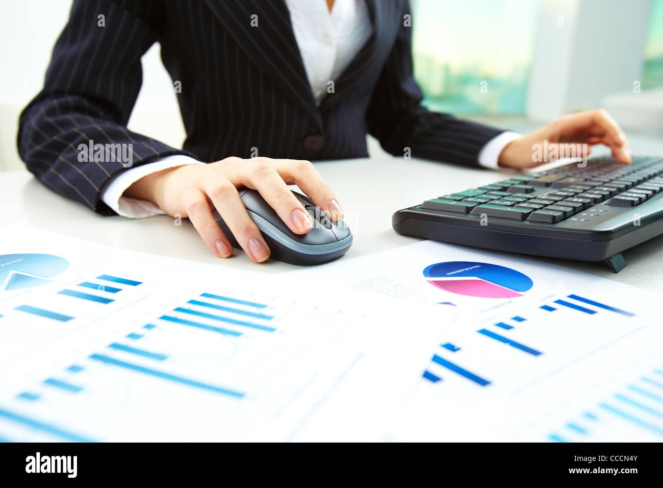 Image of female hands pushing keys of a computer mouse and keyboard ...