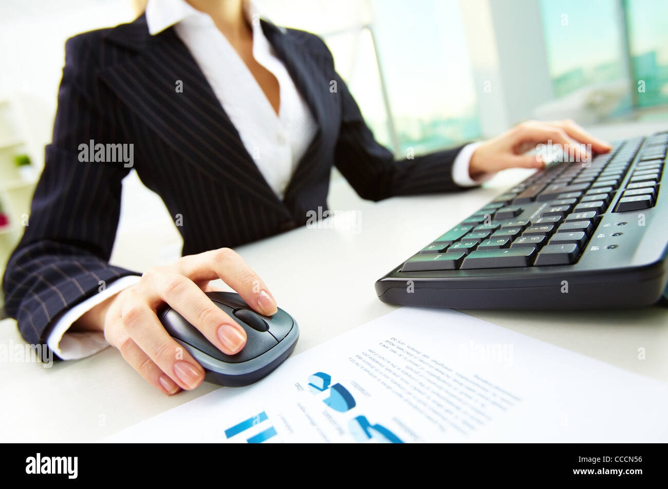 Image of female hands pushing keys of a computer mouse and keyboard ...