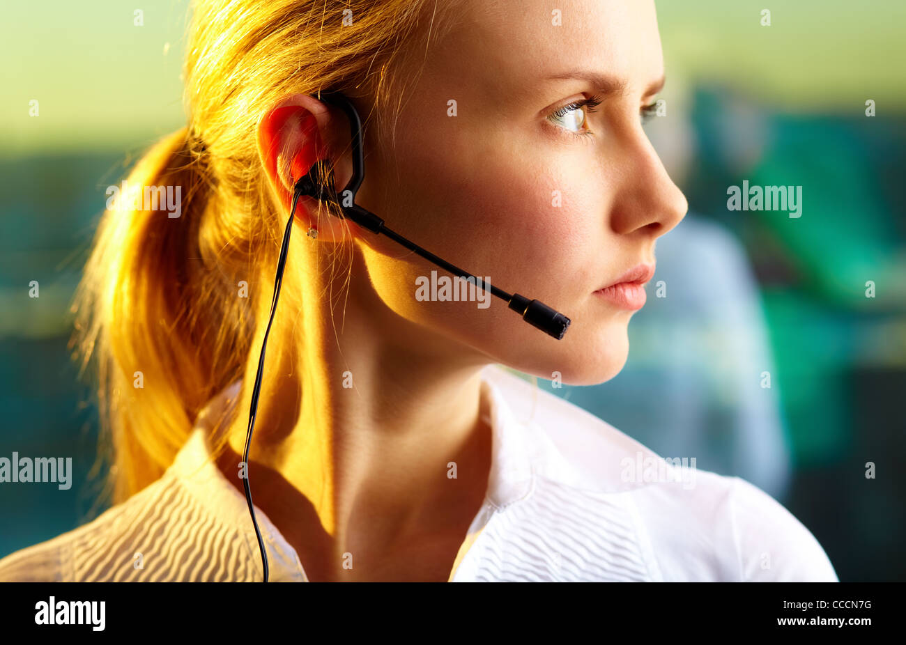 Profile of pretty woman with headset looking forward Stock Photo - Alamy
