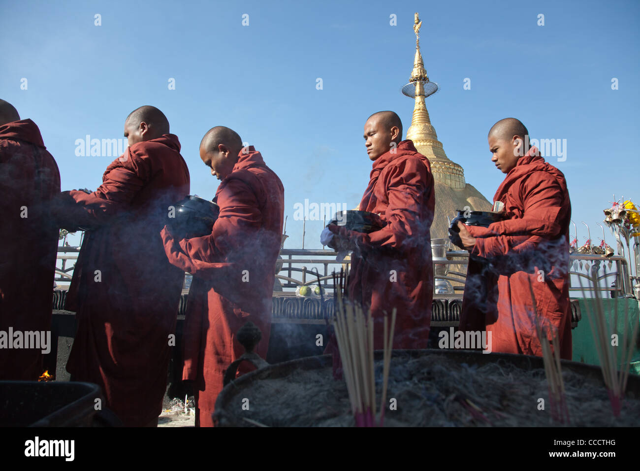 Golden Rock with walking praying monks - one of the most Buddhist ...