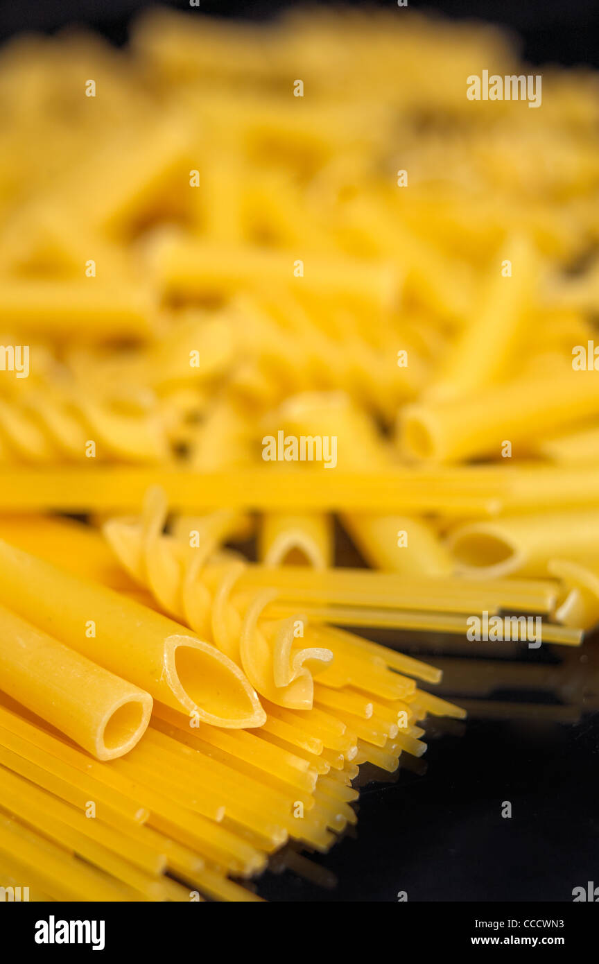 Italian pasta selection over black closeup DOF Stock Photo - Alamy