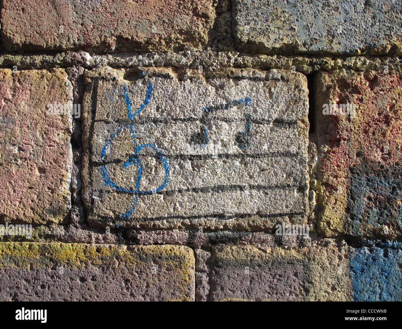 sheet music treble clef composition single note design on brick wall in ...