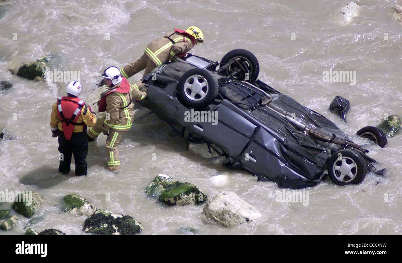 Firemen and Coastguards at Beachy Head where a car drove over the cliff ...