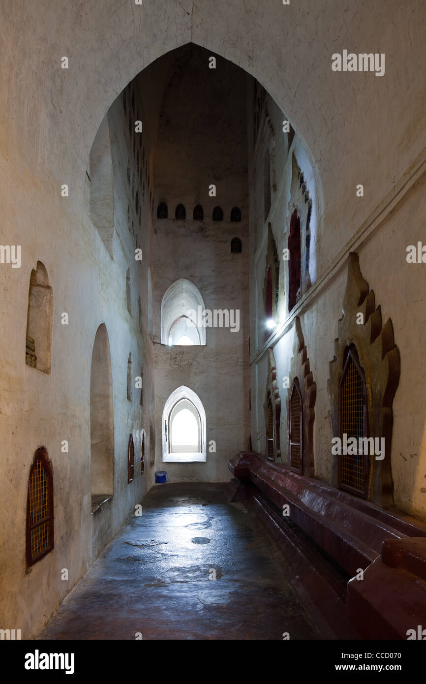 Interior of Ananda temple with corridors and lighting holes. Bagan ...