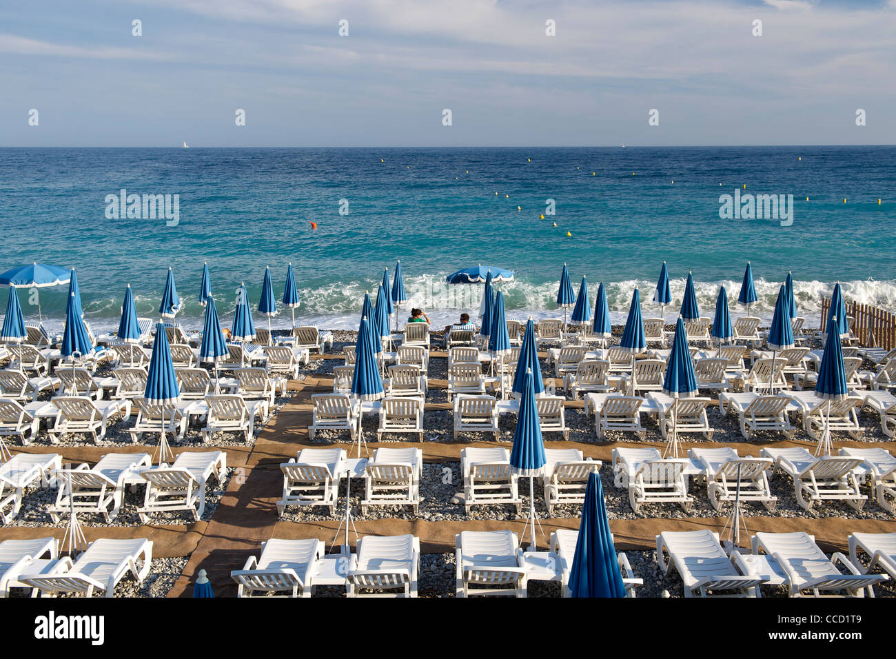 Sun loungers on the beach in Nice on the Mediterranean coast in ...