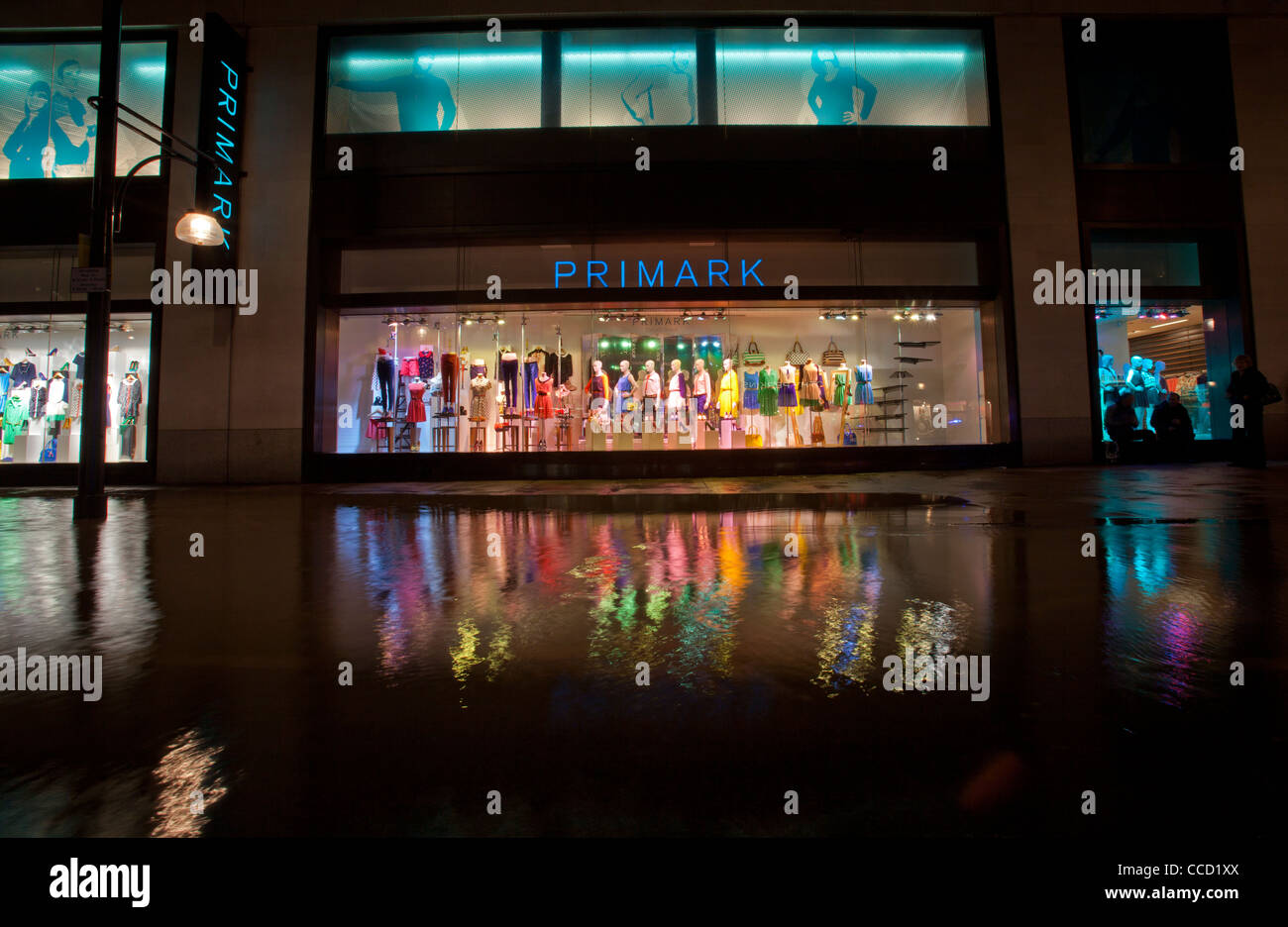 Primark shopfront and reflection in flood water after water mains burst ...