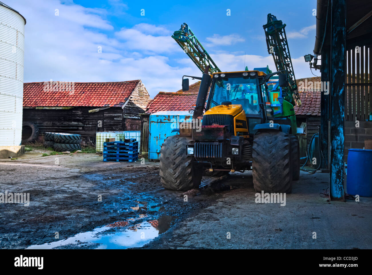 tractor and old barns Stock Photo - Alamy