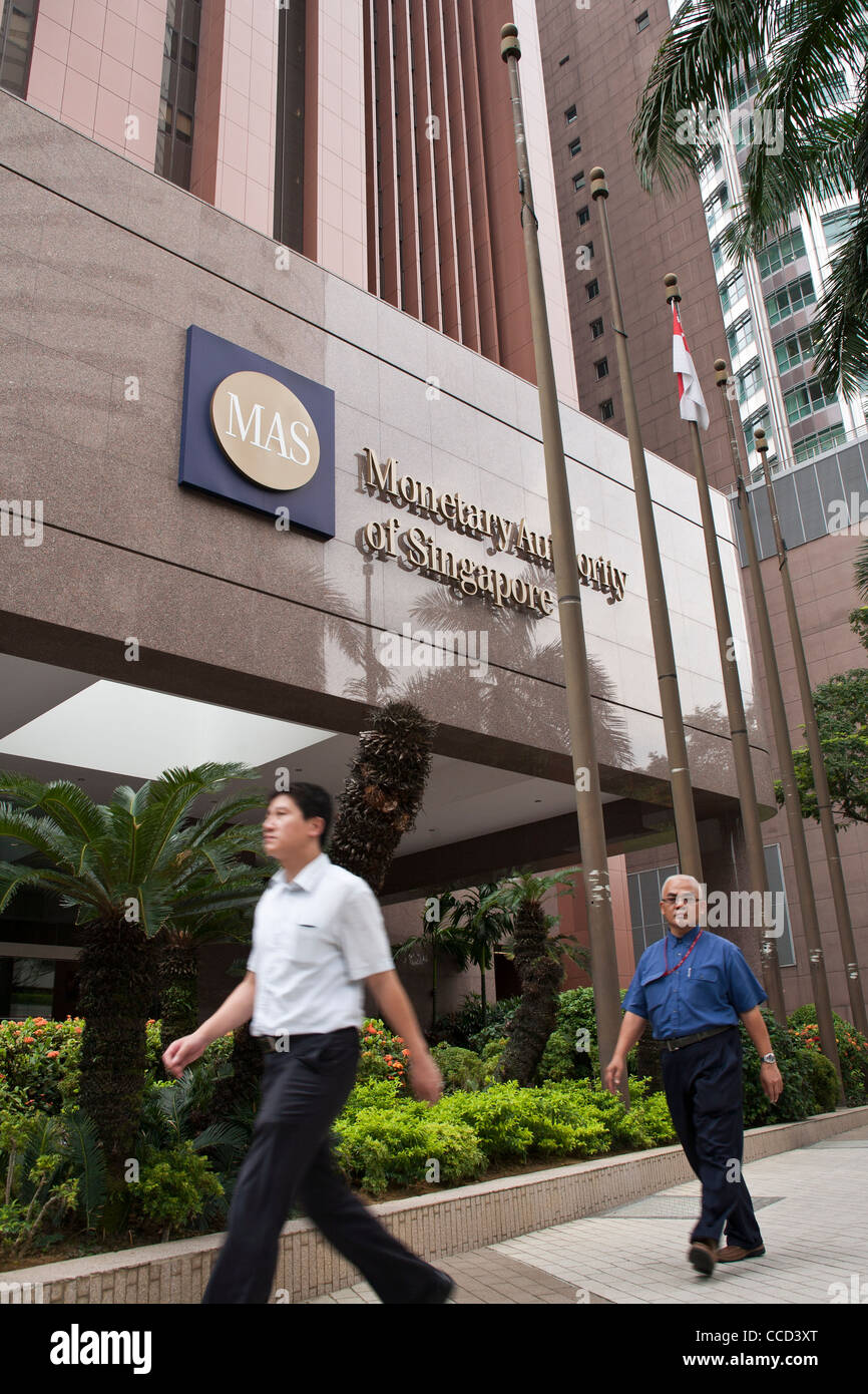 People walk past the the Monetary Authority of Singapore (MAS) building ...
