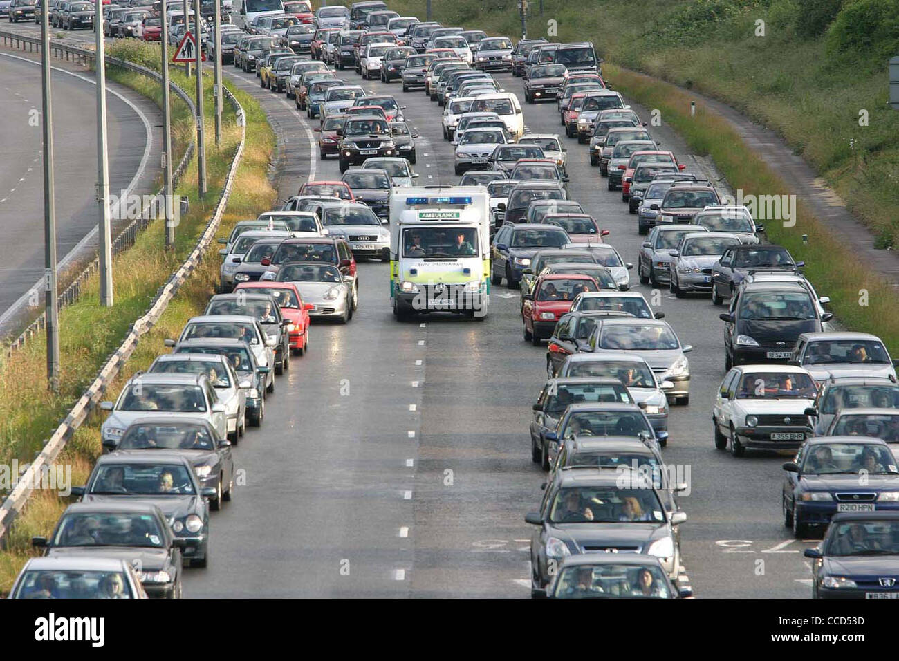 Cars clear the way for a ambulance on its way to an emergency. Picture ...