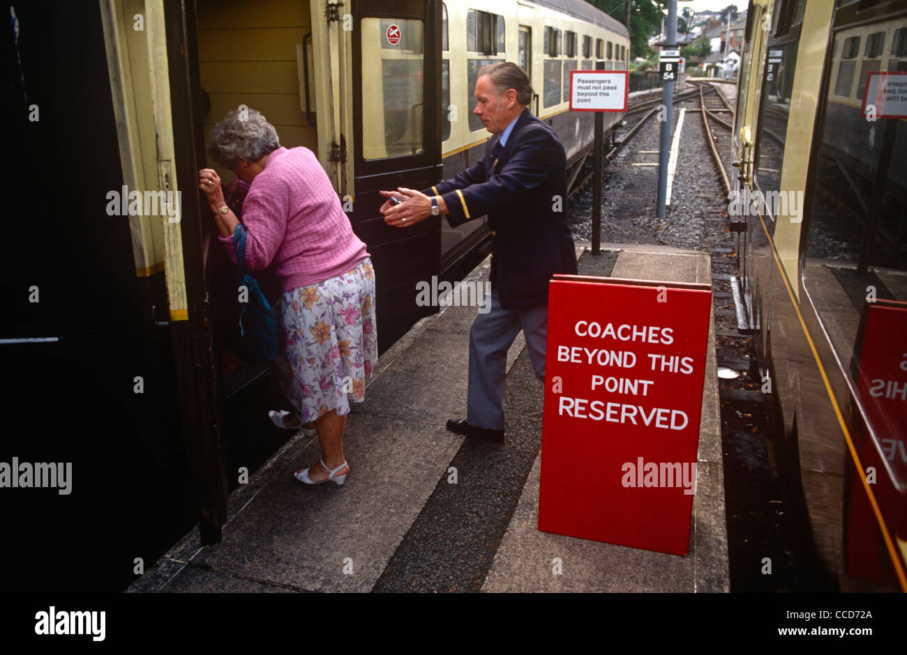 Helping old lady train platform hi-res stock photography and images - Alamy