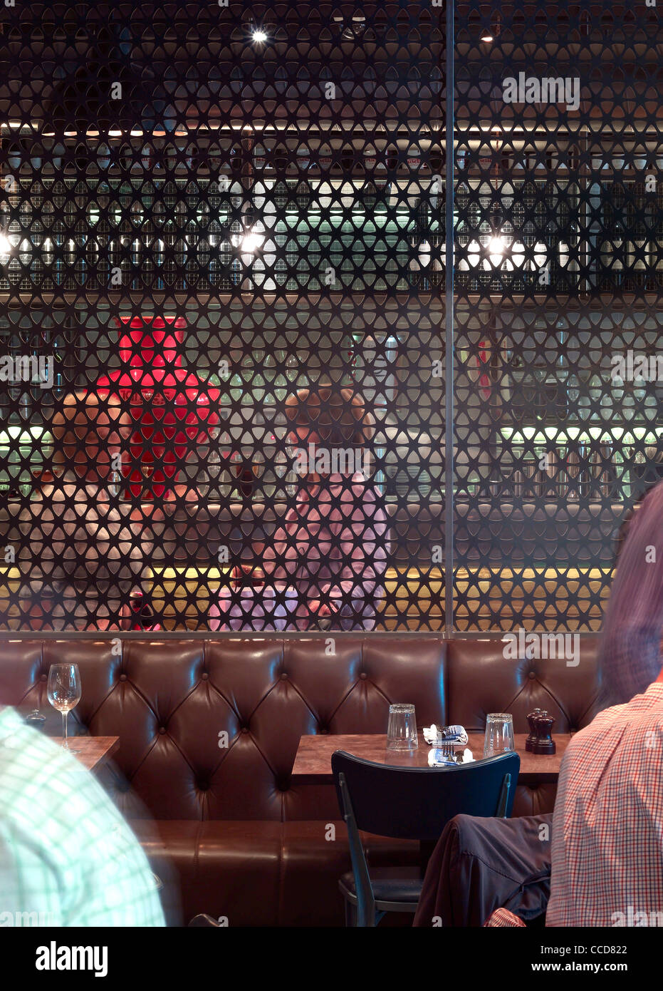 screen between restaurant and bar with diners Stock Photo - Alamy