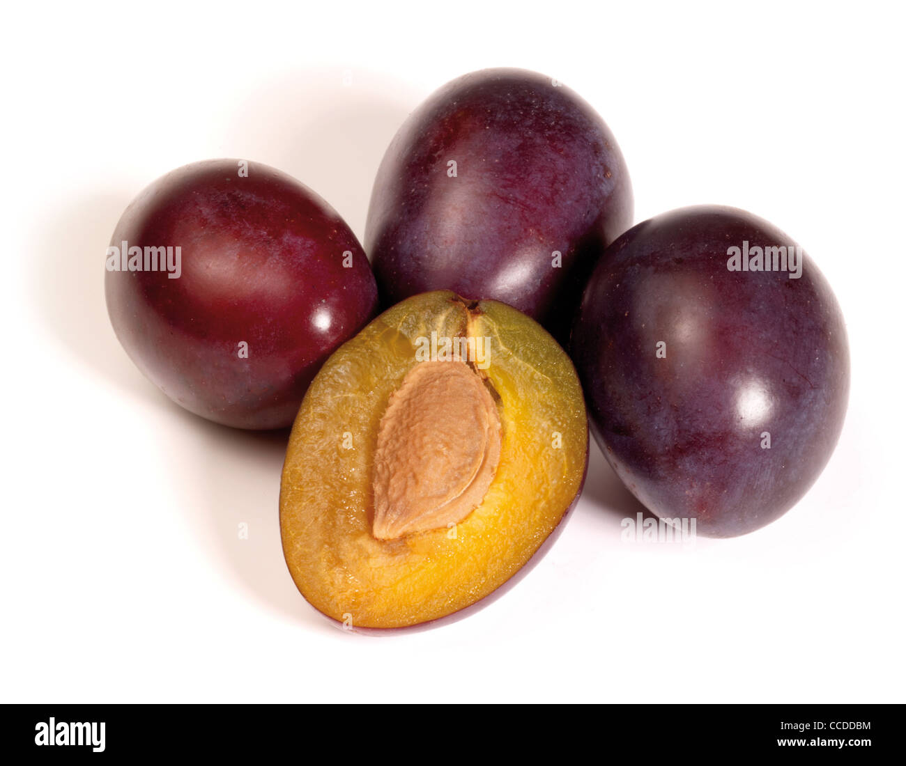 some plums in white back Stock Photo - Alamy