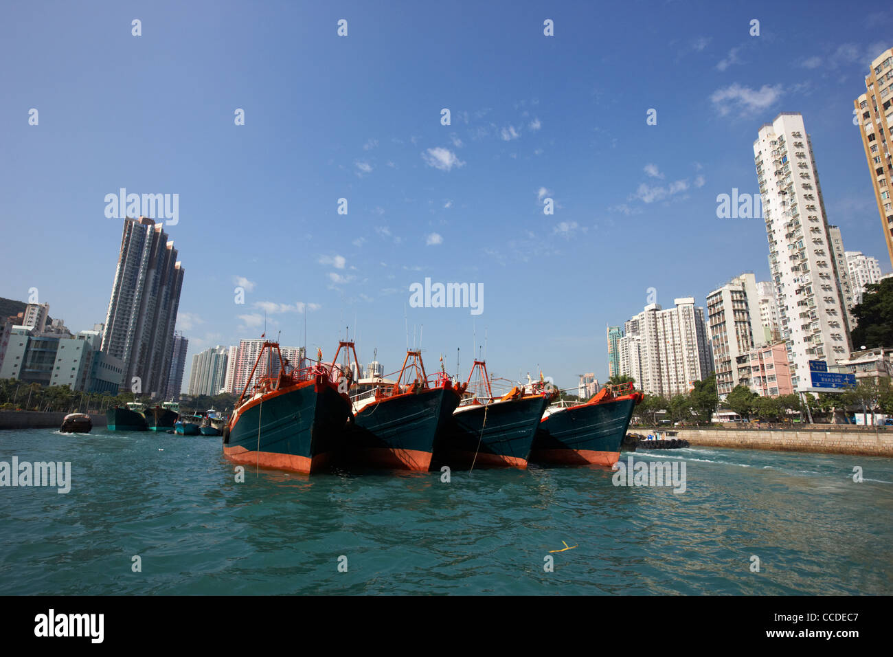 row of fishing boats anchored in the middle of aberdeen harbour hong ...