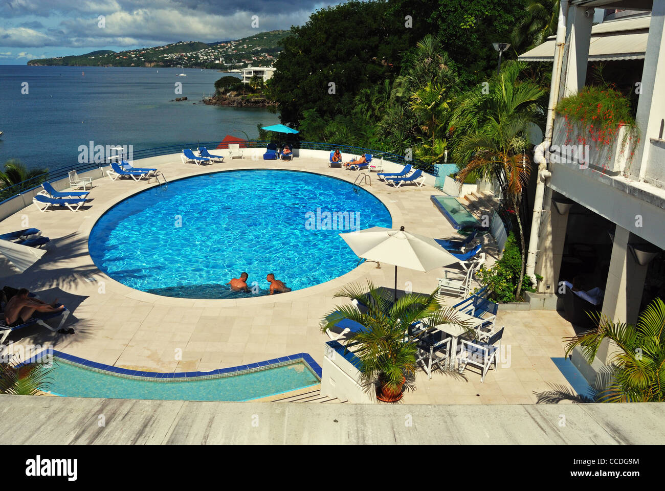 Hotel swimming pool on the edge of the sea, Port de France, Martinique ...