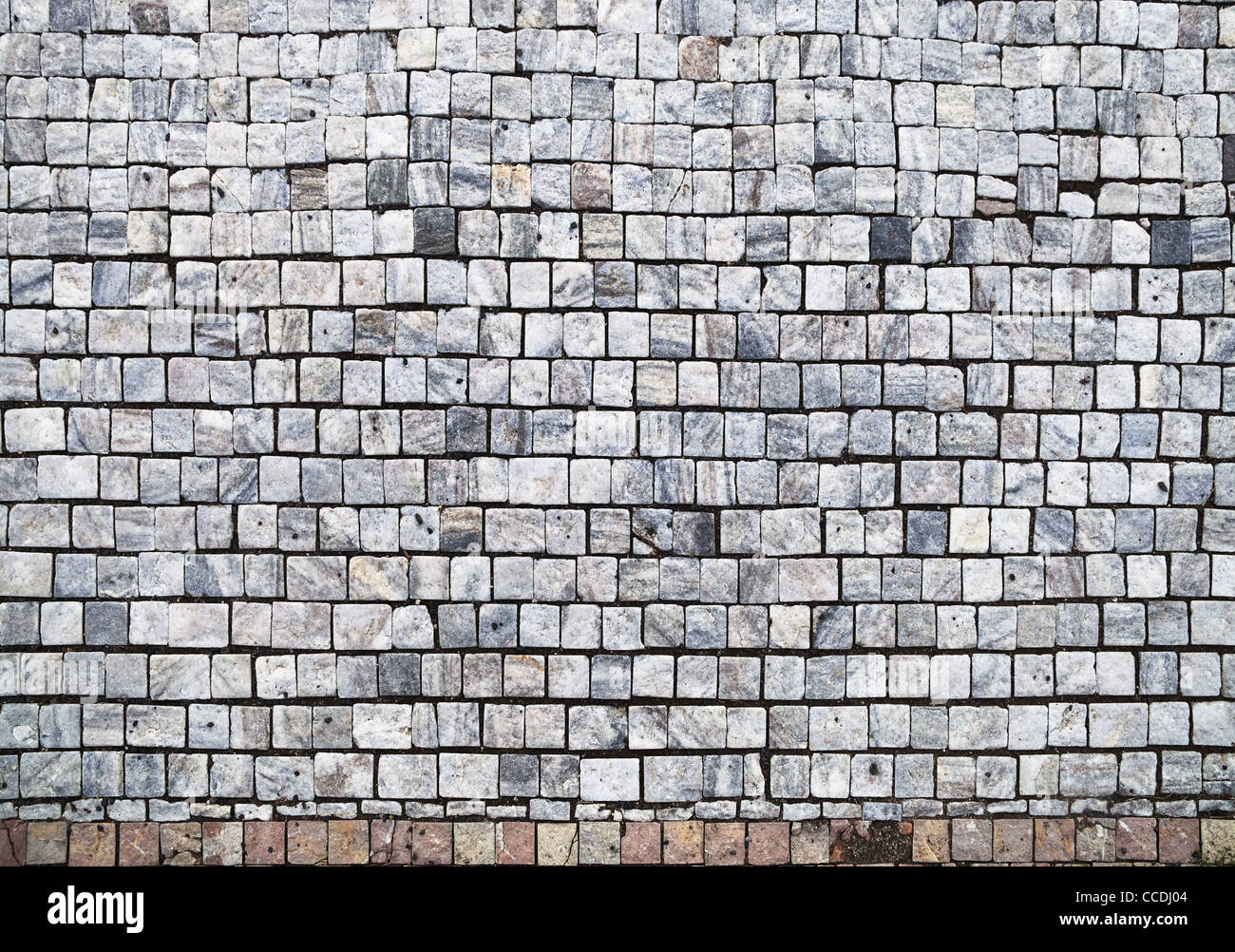Closeup view on a cobblestone road - pattern - background Stock Photo ...