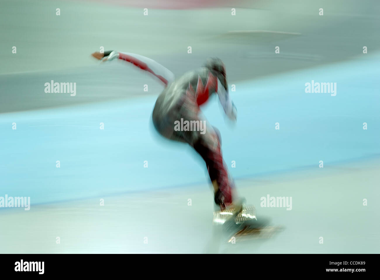 Blurred action of speed skater Stock Photo - Alamy