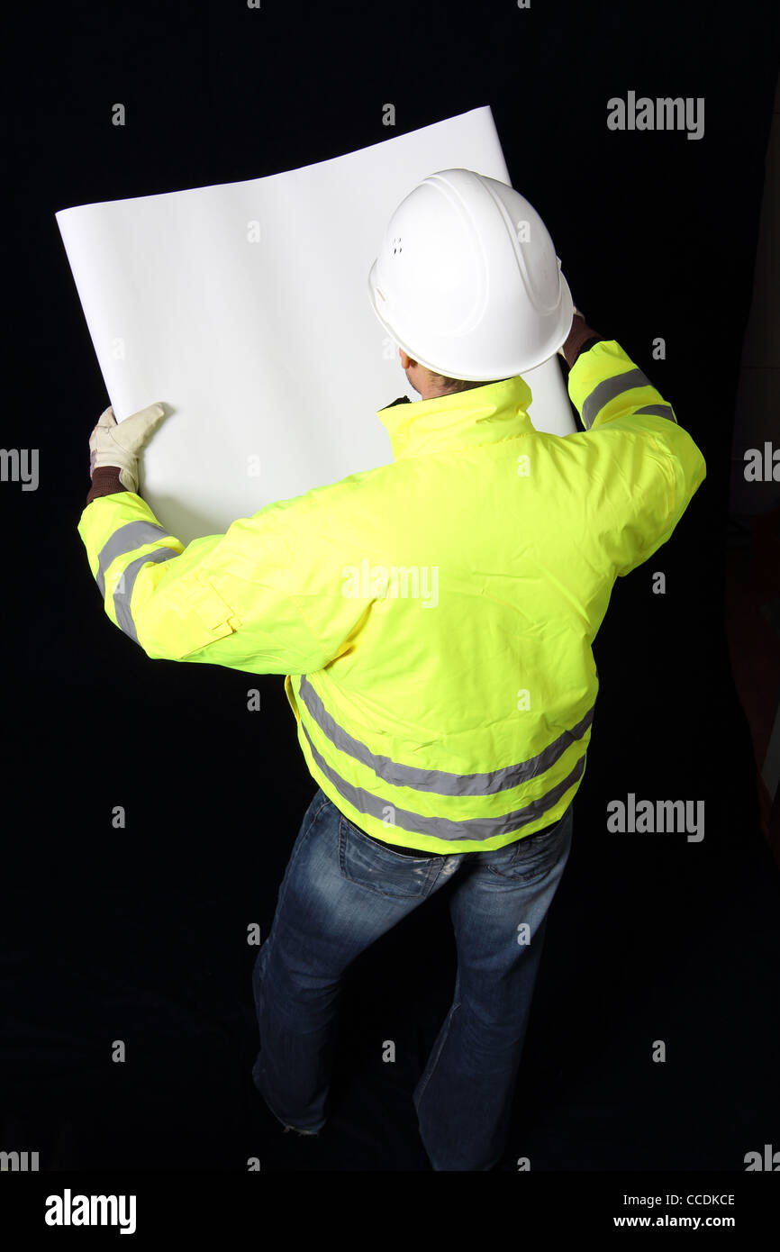Building worker with plan Stock Photo - Alamy