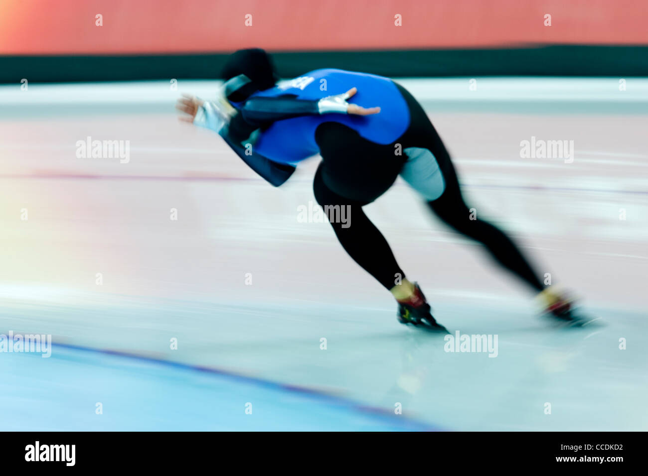 Blurred action of speed skater Stock Photo - Alamy