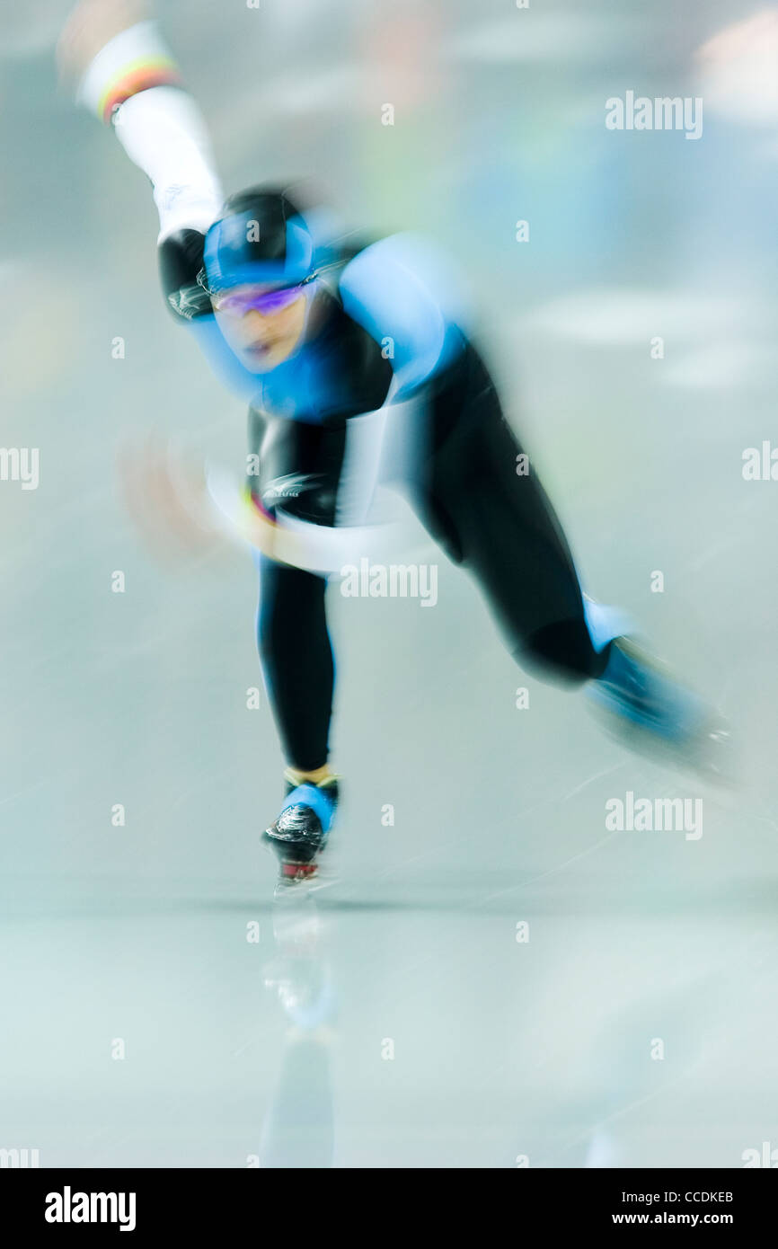 Blurred action of speed skater Stock Photo - Alamy