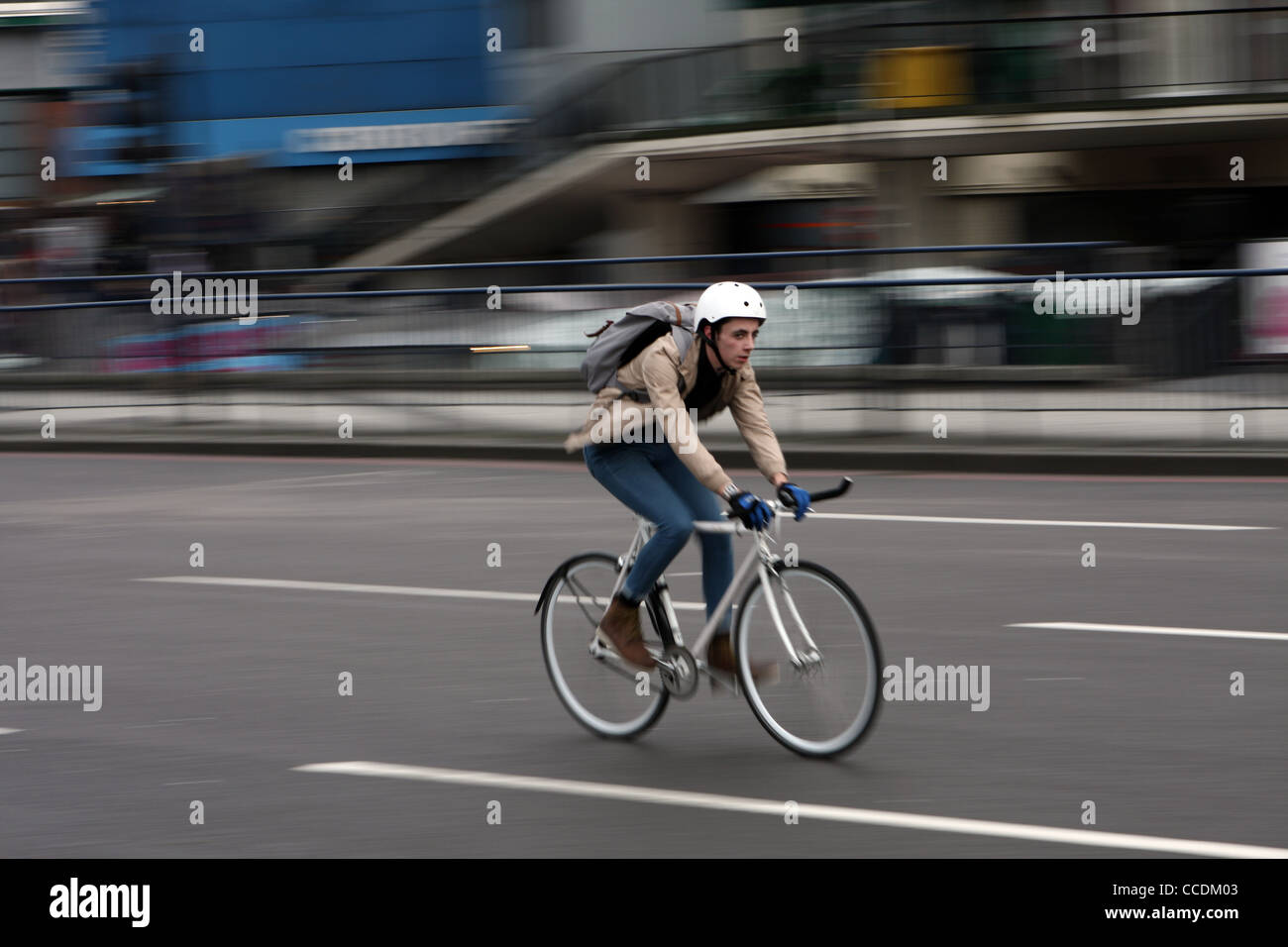 a man riding his bicycle in London Stock Photo - Alamy