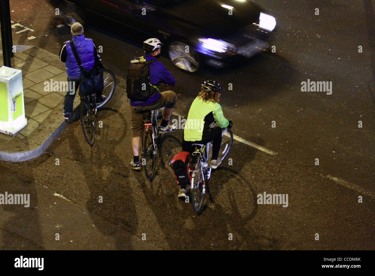Three cyclists road junction hi-res stock photography and images - Alamy