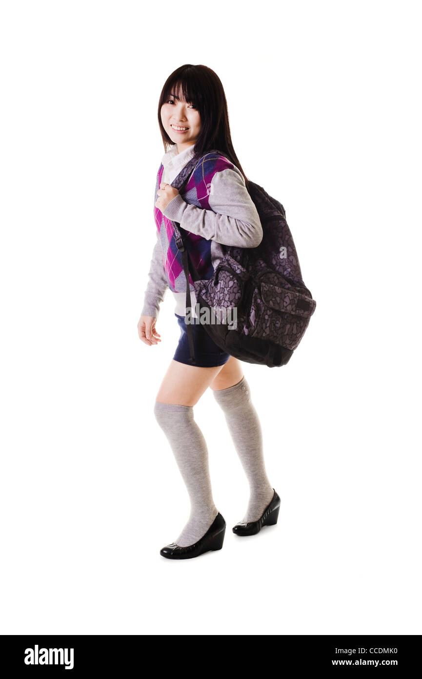 Lady walking with a backpack Cut Out Stock Images & Pictures - Alamy