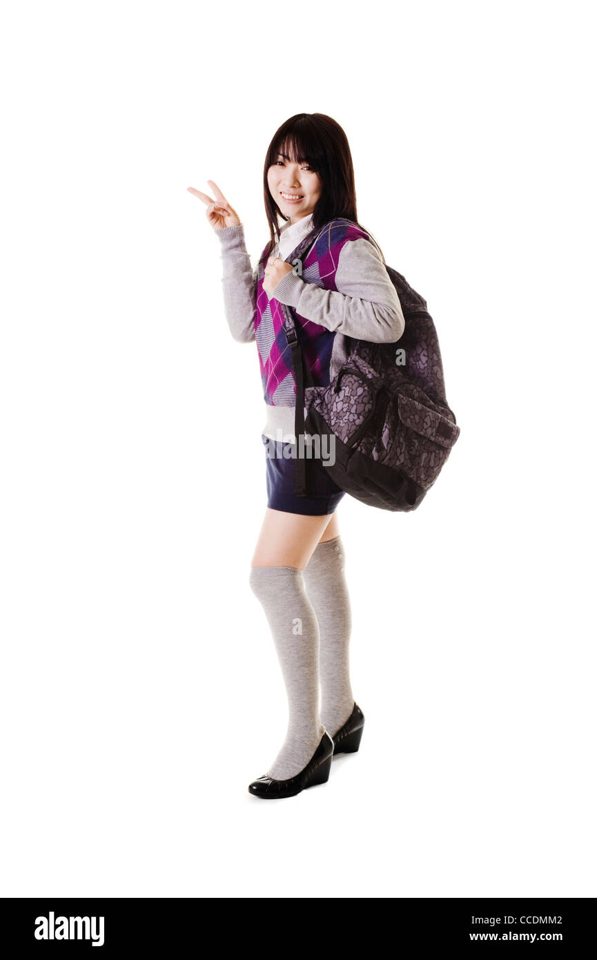 Female Chinese student with a backpack on a white background showing ...