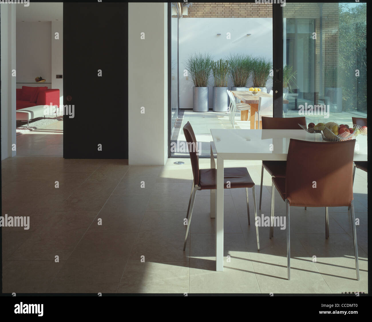 PRIVATE HOUSE DINING TO EXTERIOR TERRACE AND SITTINGROOM Stock Photo ...