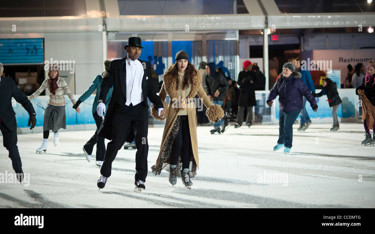 Skaters dressed in formal attire maneuver the packed Pond at Bryant ...