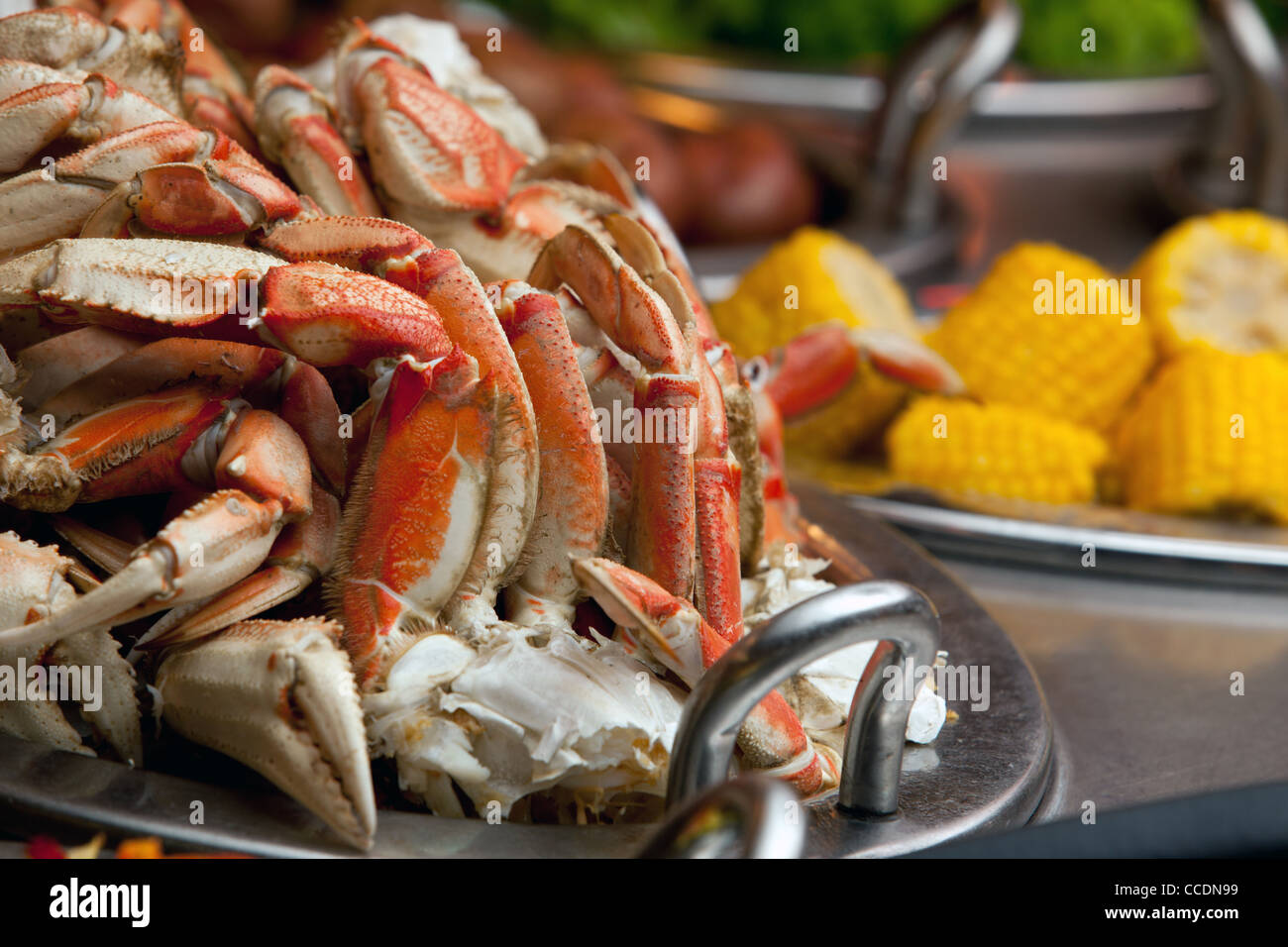 A classy buffet line at a resort's restaurant has crab legs as well as ...