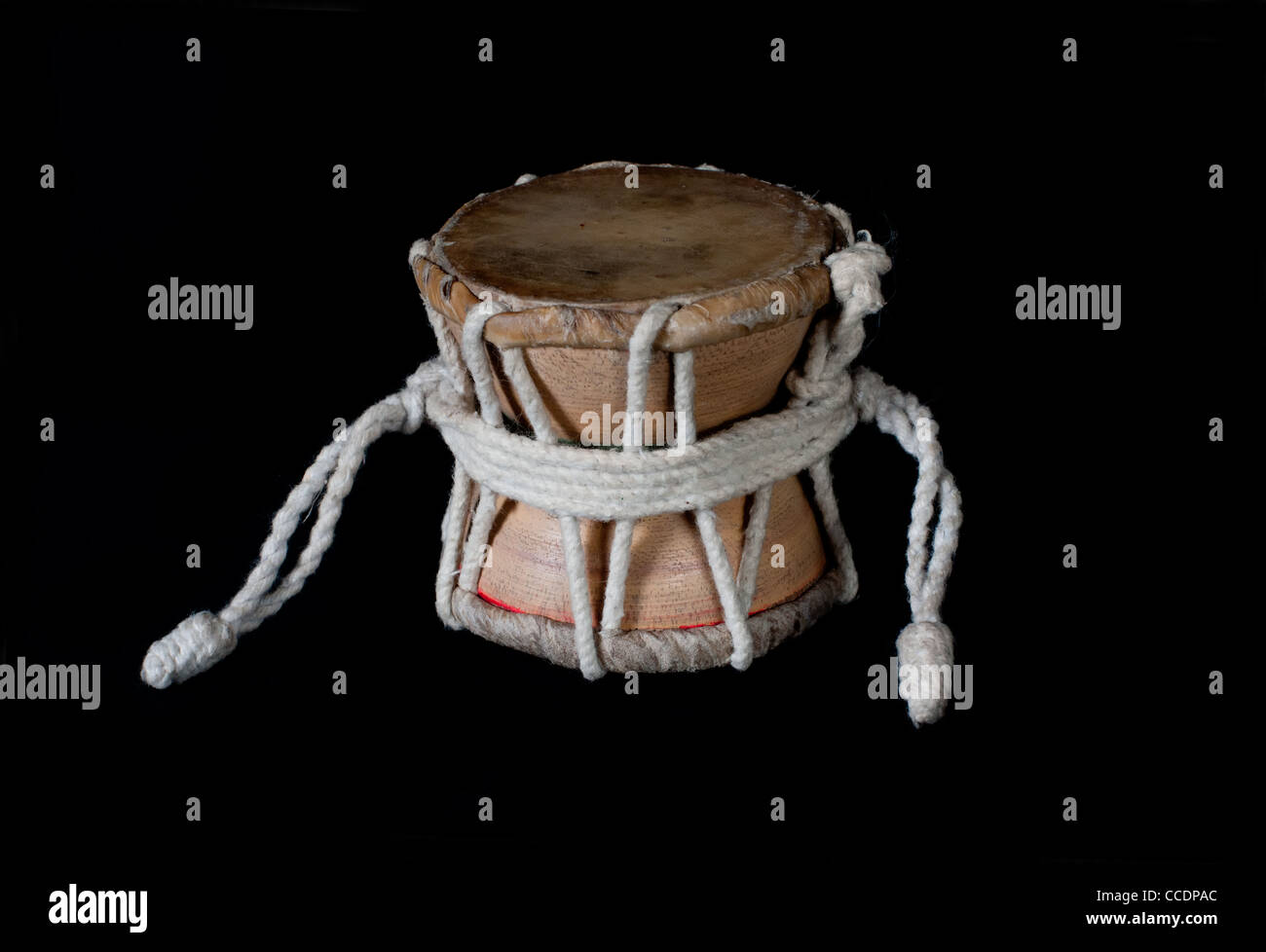 Damaru Drum. Close-up. Black background Stock Photo - Alamy
