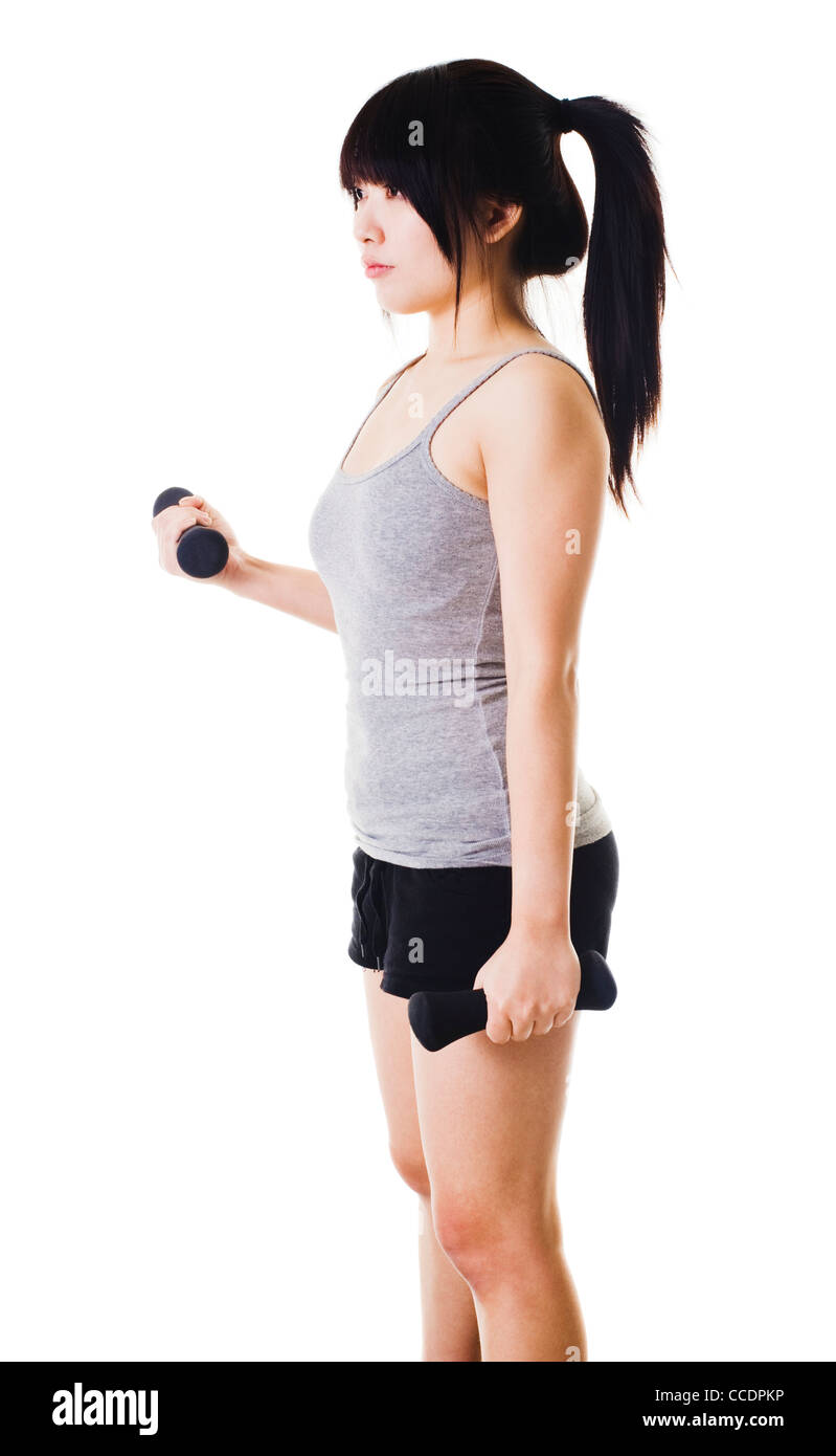 Chinese woman doing bicep curls with small hand weights Stock Photo - Alamy
