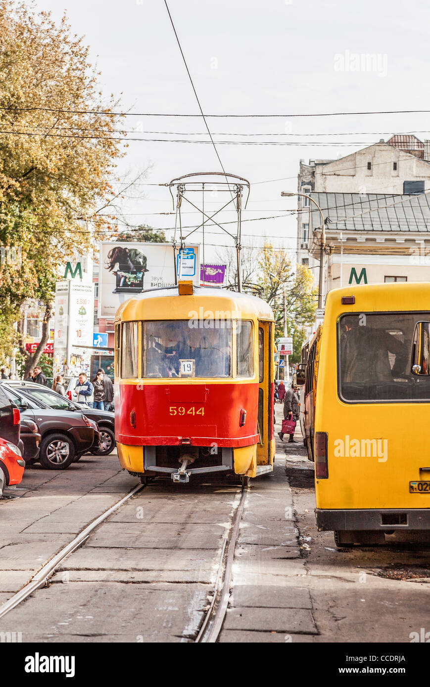 Yellow and red tram in Podil, Kiev, Ukraine, eastern Europe, alongside ...