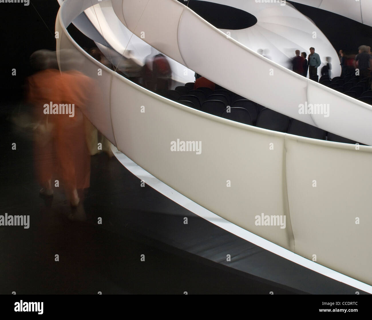 figure walking past the structure Stock Photo - Alamy
