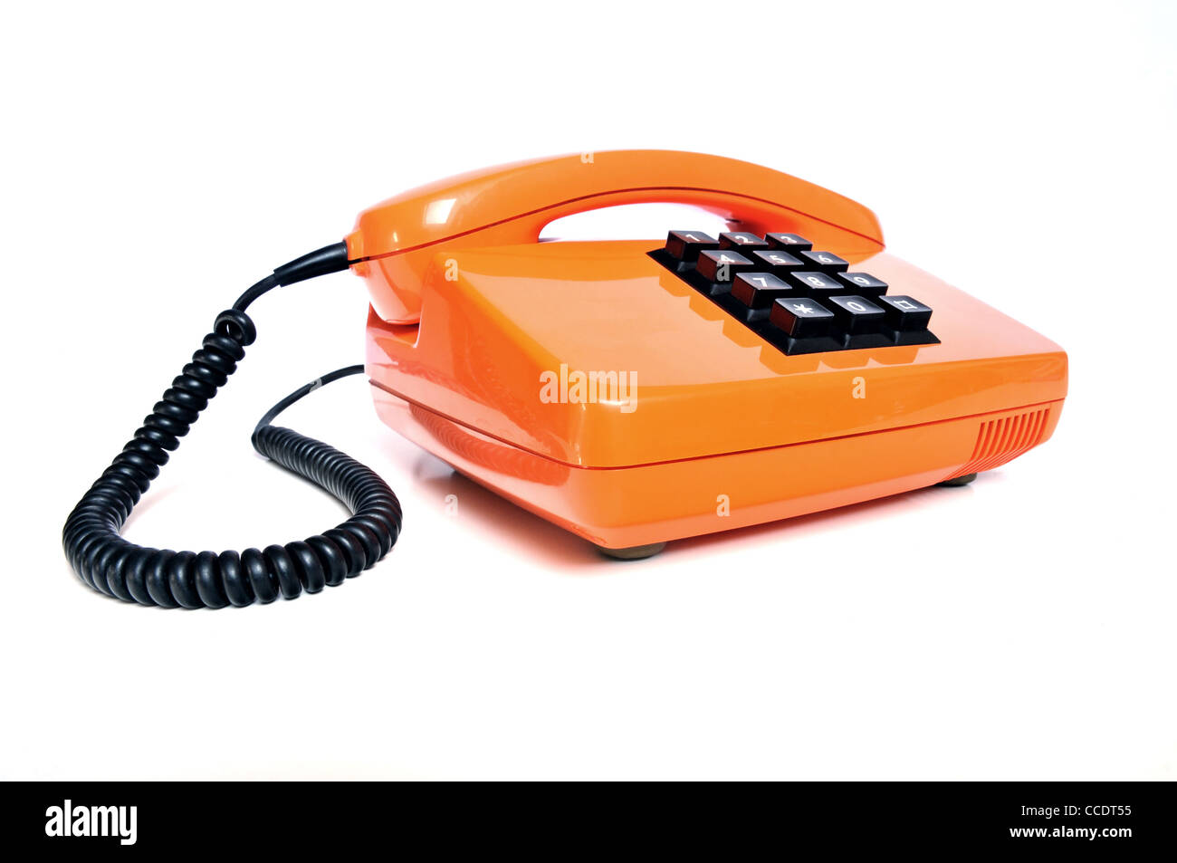 Orange colored retro telephone over white background Stock Photo - Alamy