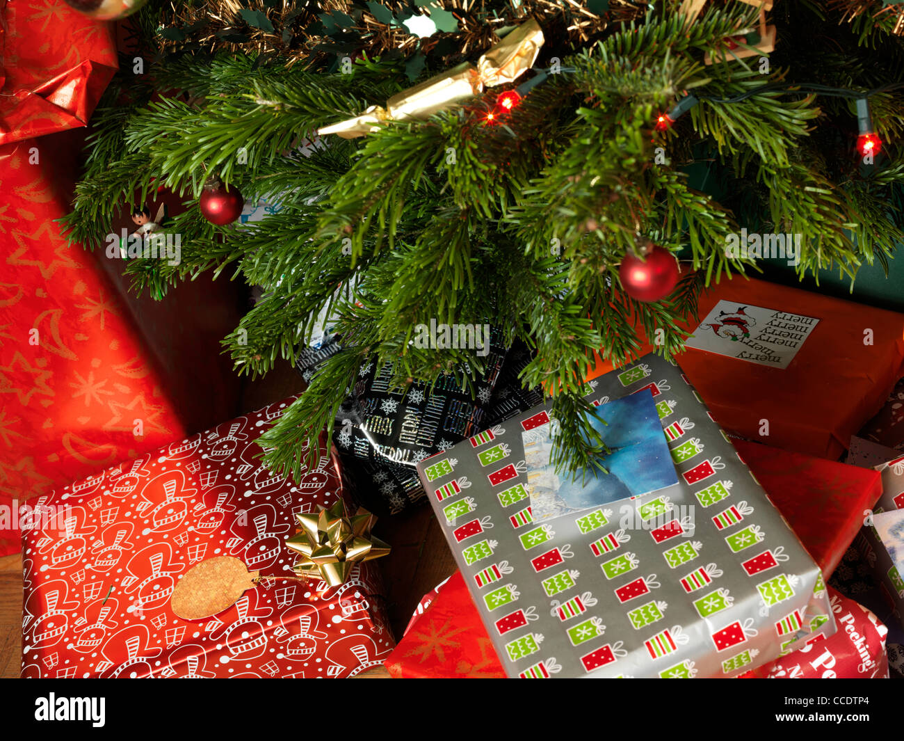 Wrapped Presents Under The Christmas Tree Stock Photo - Alamy