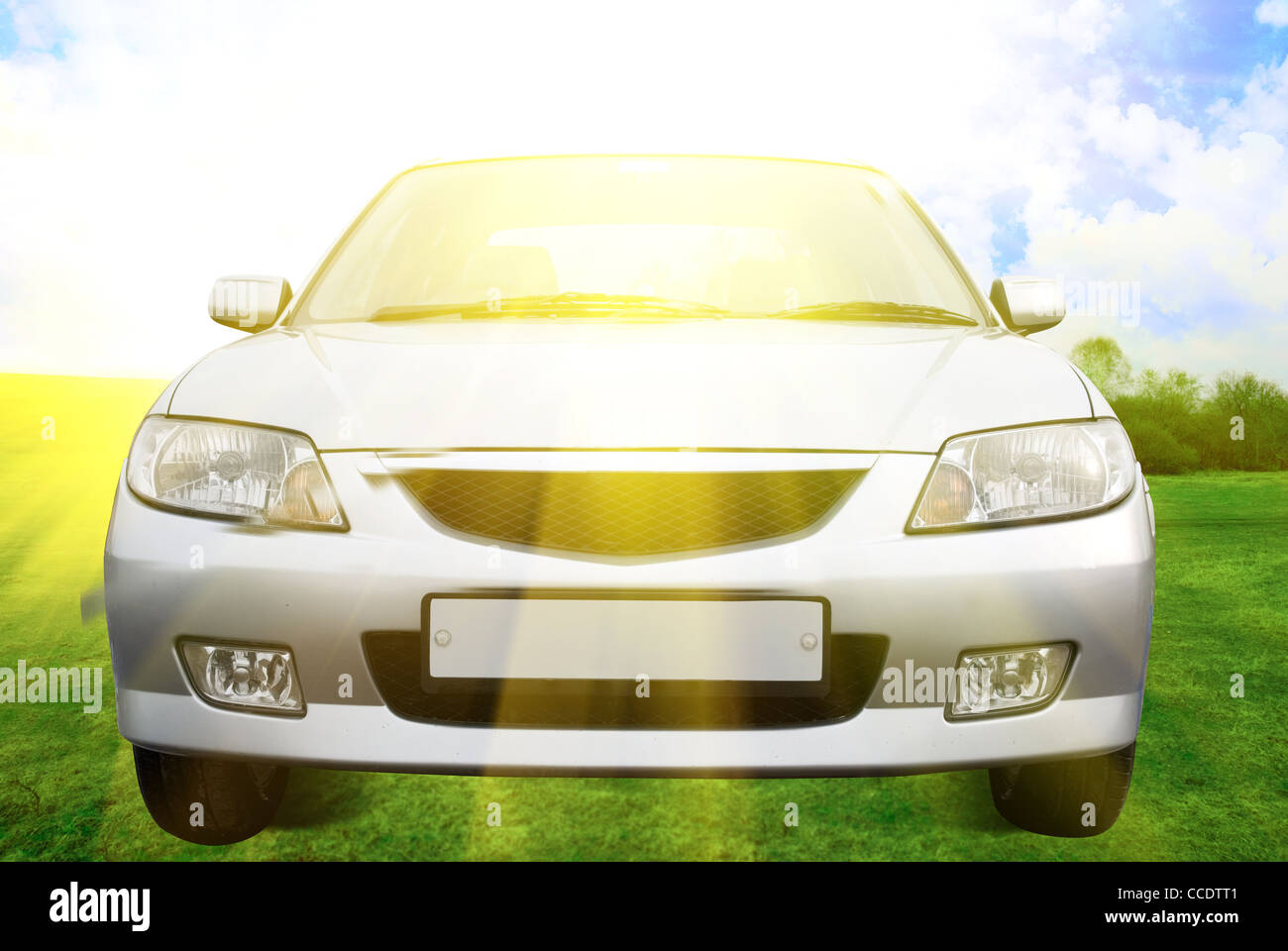 front view of auto on summer sunrise background Stock Photo - Alamy