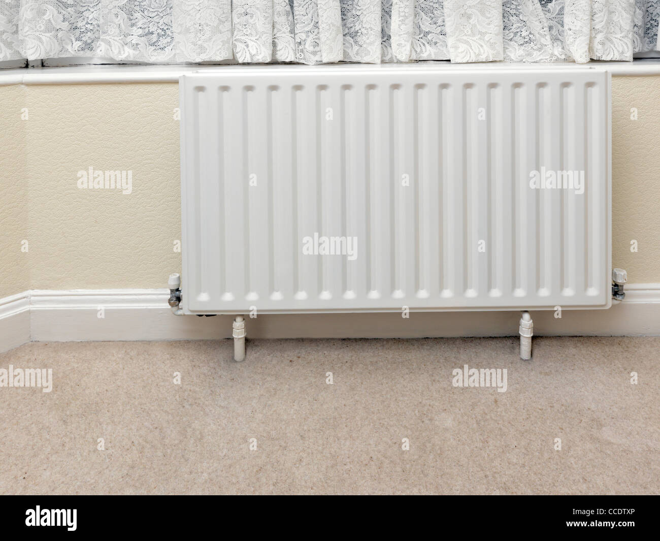 Radiator Under A Window Stock Photo - Alamy