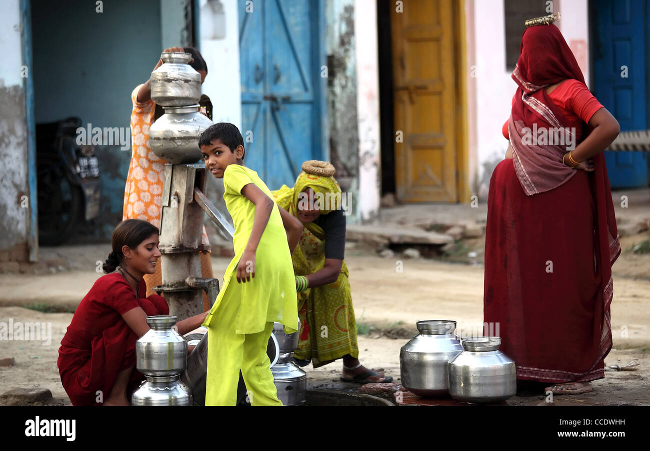People collecting drinking water from Handpump Stock Photo - Alamy