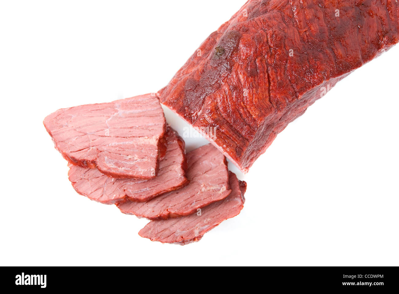 Slices of a beef on plate isolated on white Stock Photo - Alamy