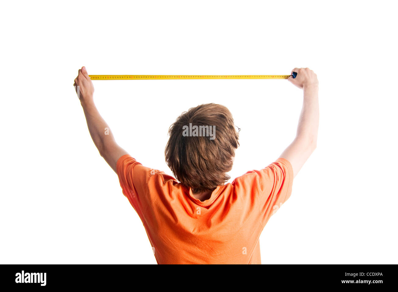 Young man measuring something with ruler on white Stock Photo - Alamy