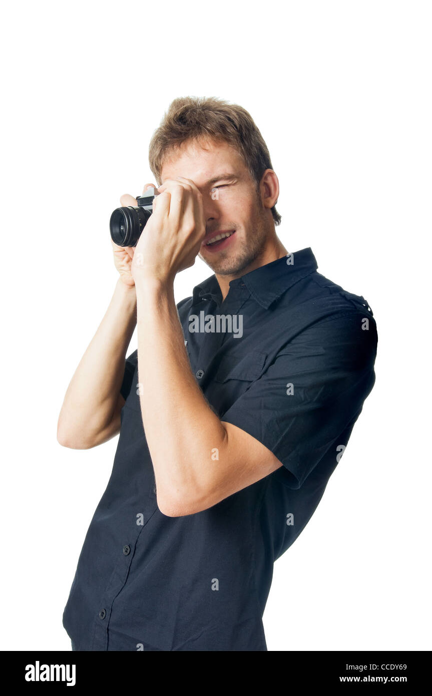 Young man standing with film camera isolated on white background Stock ...