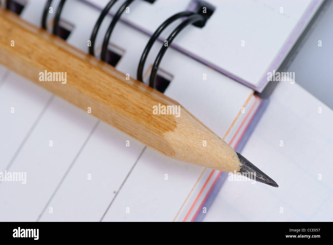 Notebook and pencil Stock Photo - Alamy