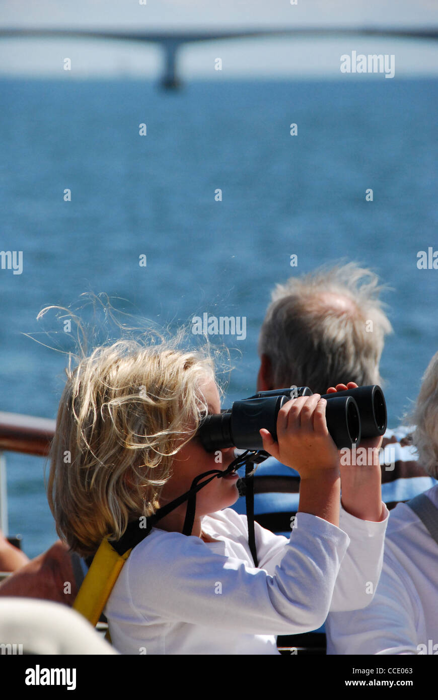 Little girl with binoculars on boat Stock Photo - Alamy