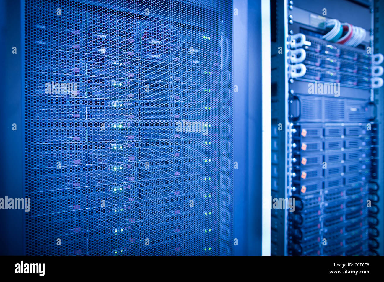 Server rack cluster in a data center (shallow DOF; color toned image ...
