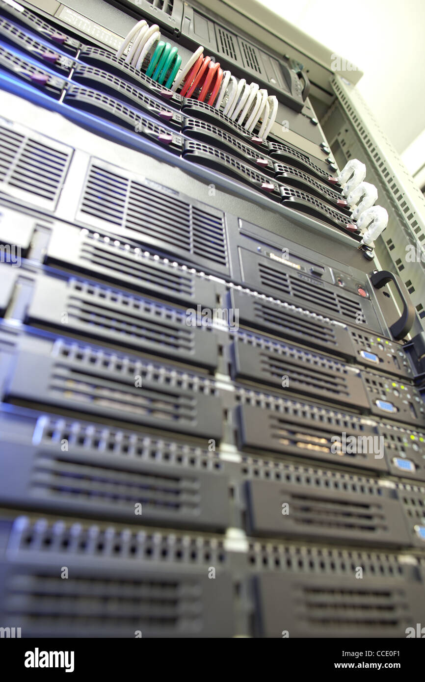 Server rack cluster in a data center (shallow DOF; color toned image ...