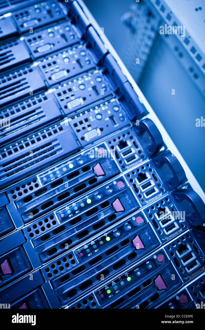 Server rack cluster in a data center (shallow DOF; color toned image ...