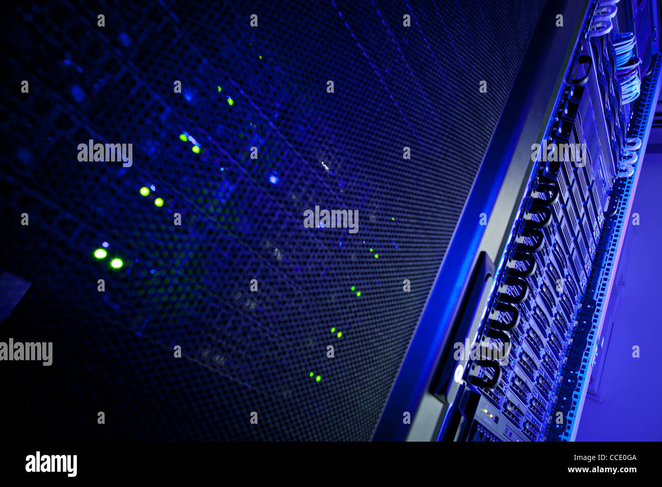 Server rack cluster in a data center (shallow DOF; color toned image ...