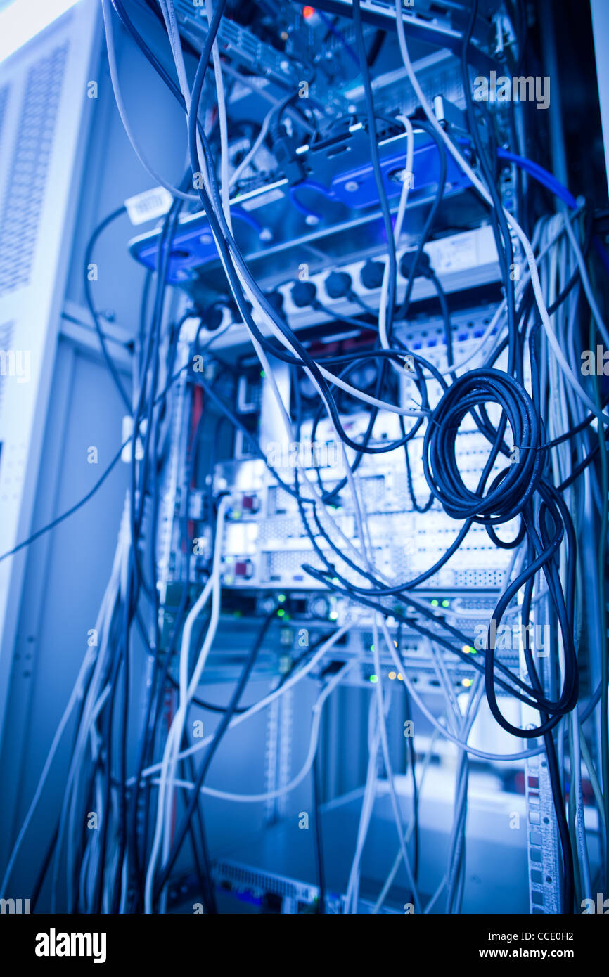 Server rack cluster in a data center (shallow DOF; color toned image ...